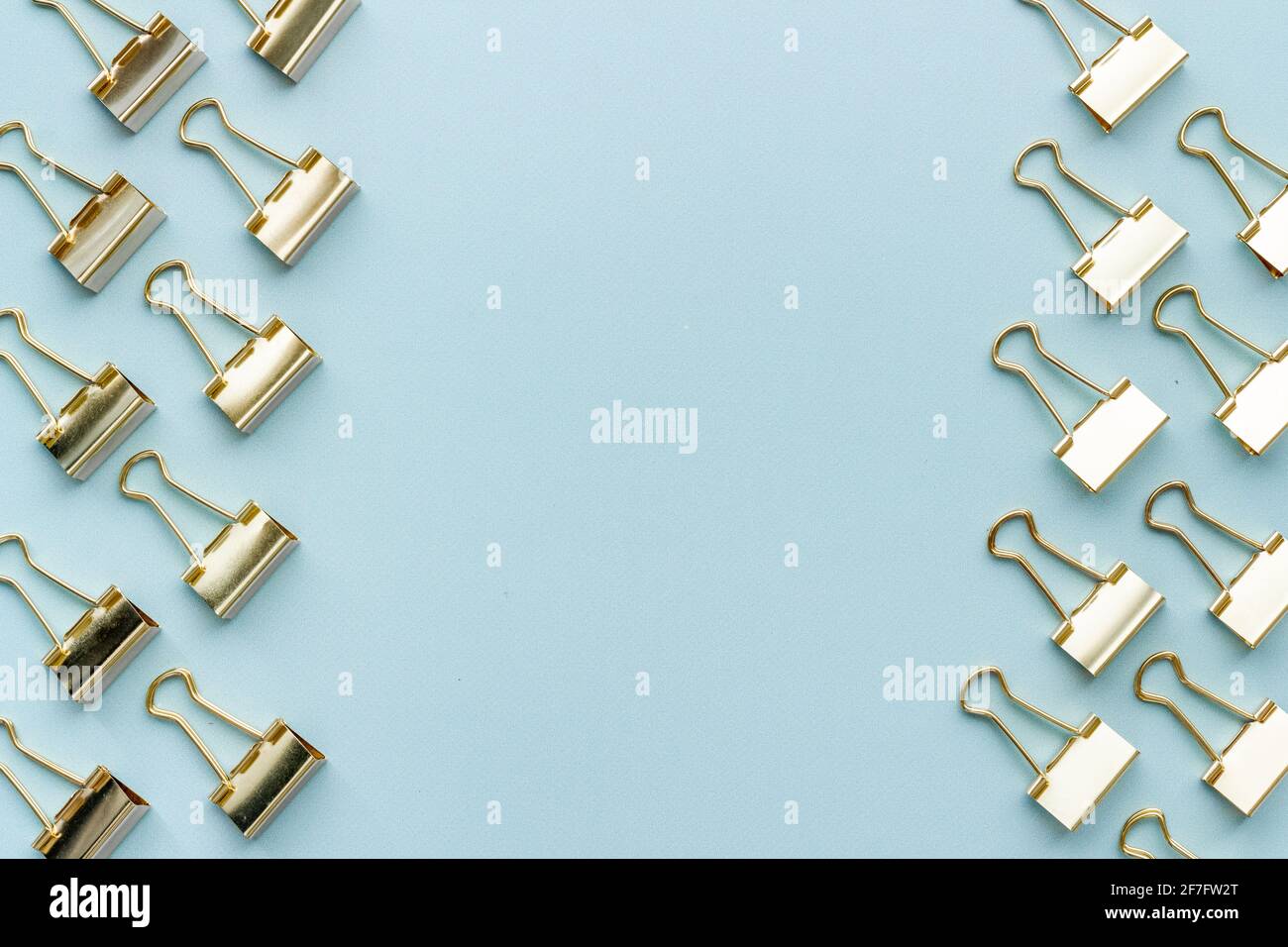 Office supplies background - paper binder clips top view Stock Photo ...