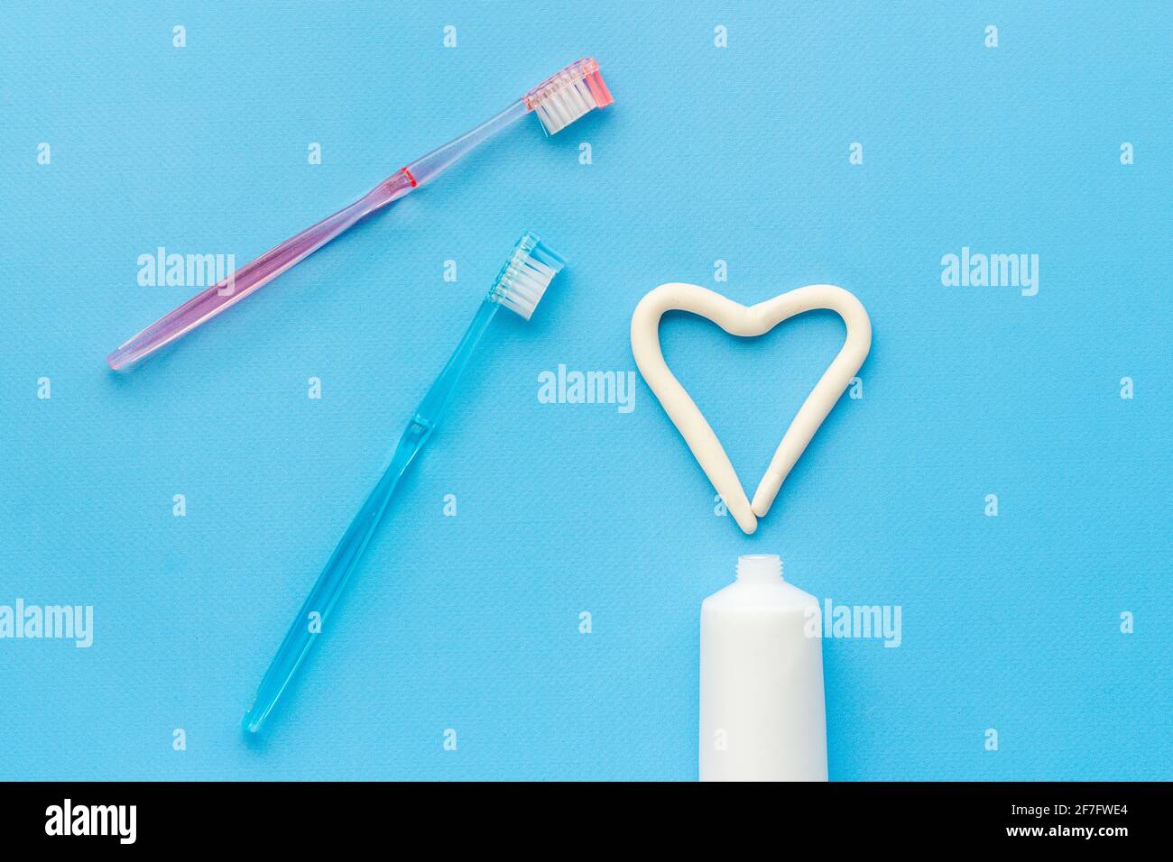 Heart shape of toothpaste with toothbrush, top view. Oral care and ...
