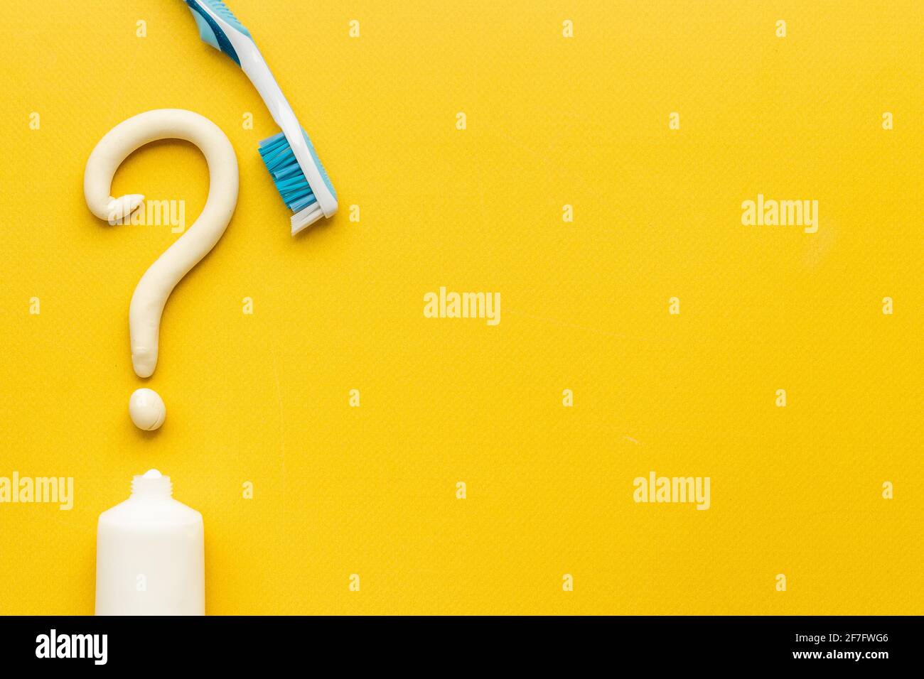 Question mark of toothpaste with toothbrush, top view. Oral care and ...