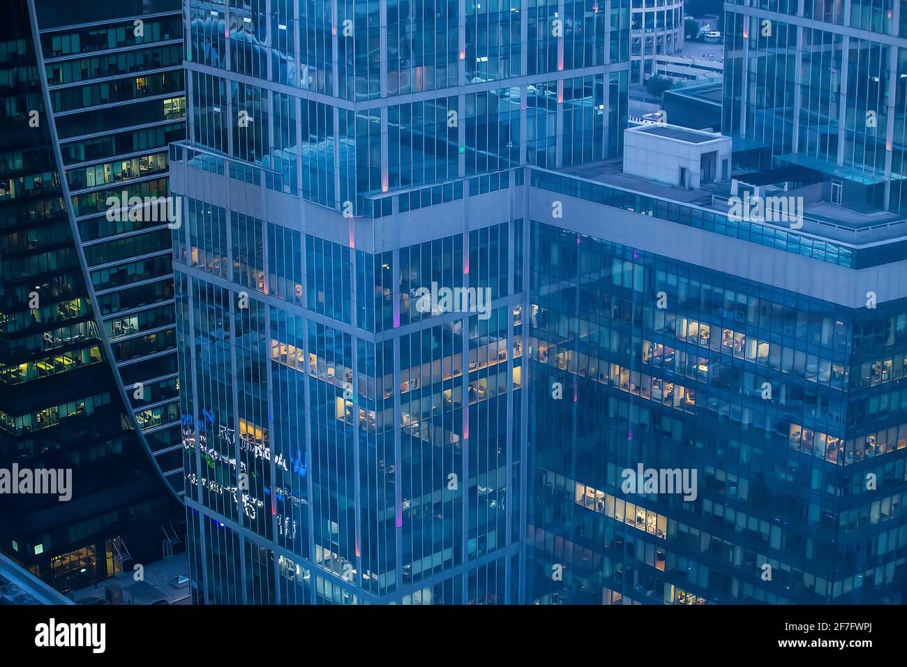 Modern office skyscraper at dusk. Light in the windows Stock Photo - Alamy
