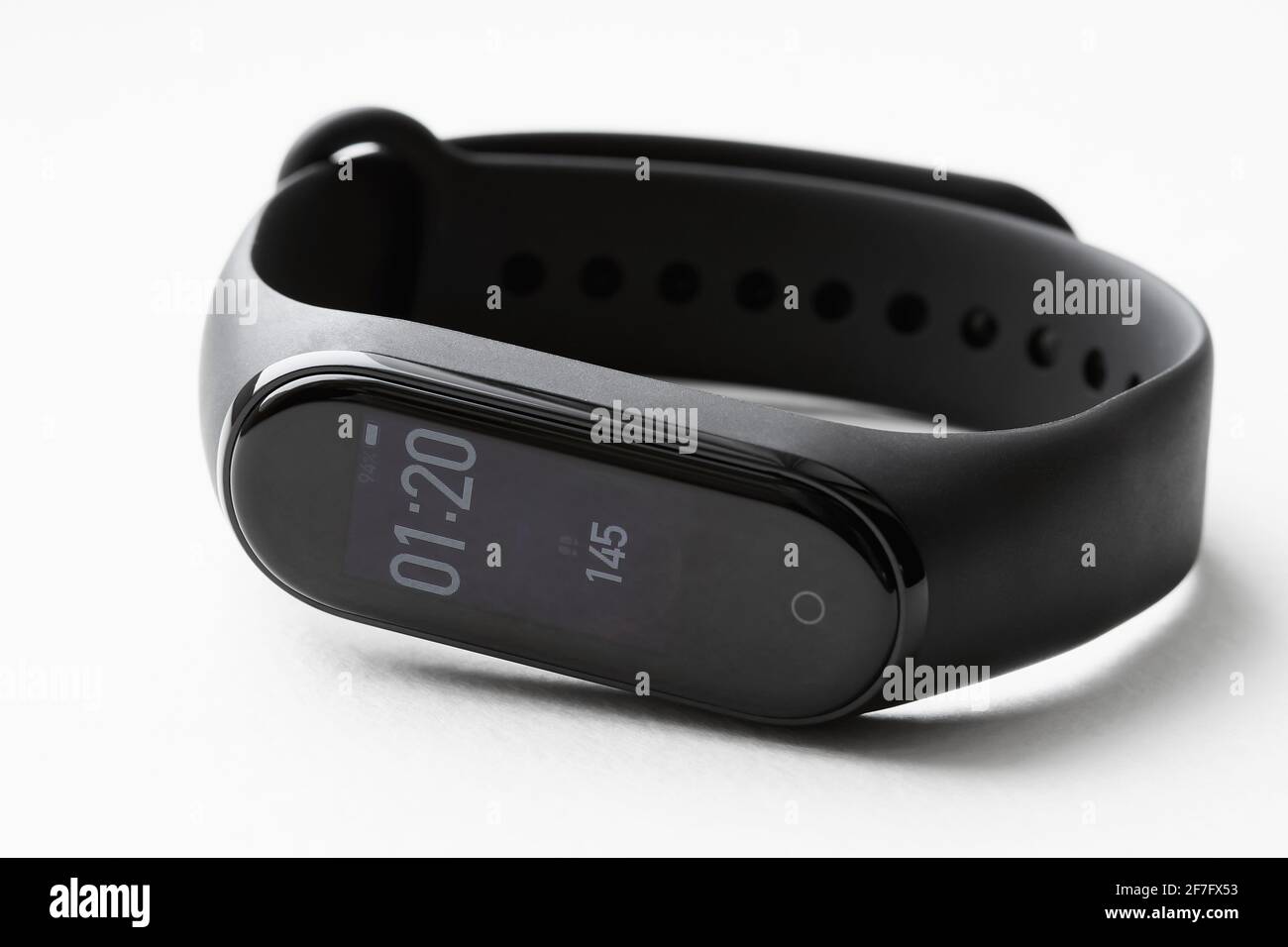 Black fitness watch or activity tracker with time and steps on display ...