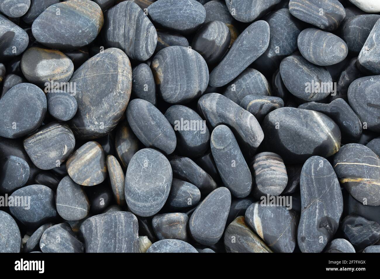 colorful black rock on beach from beauty stone island travel location ...