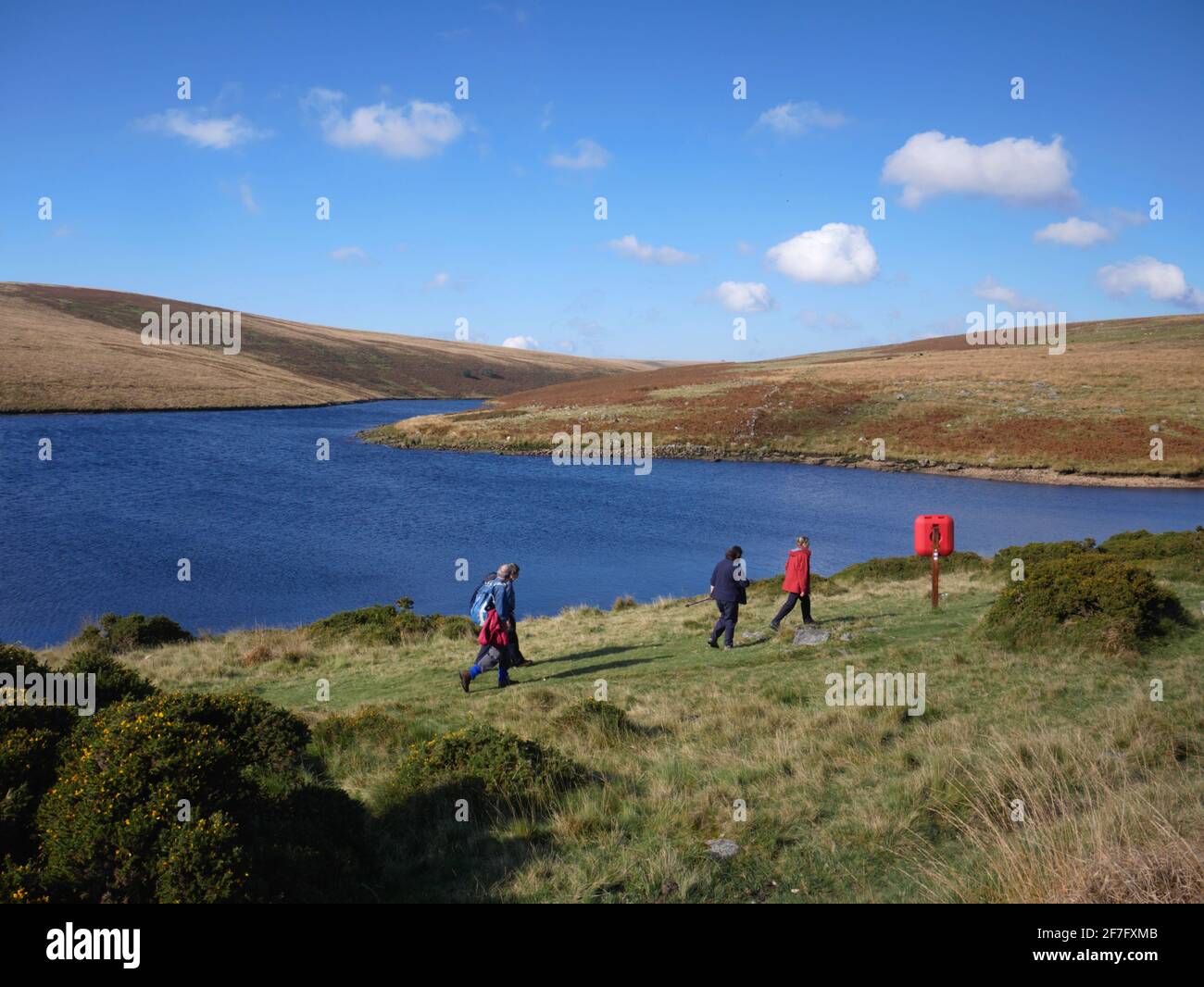 Walkers beside the Avon Dam reservoir, near South Brent, Dartmoor ...
