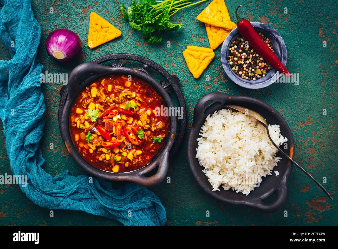 Hot Mexican Chili con carne with rice and tortilla chips and spices ...