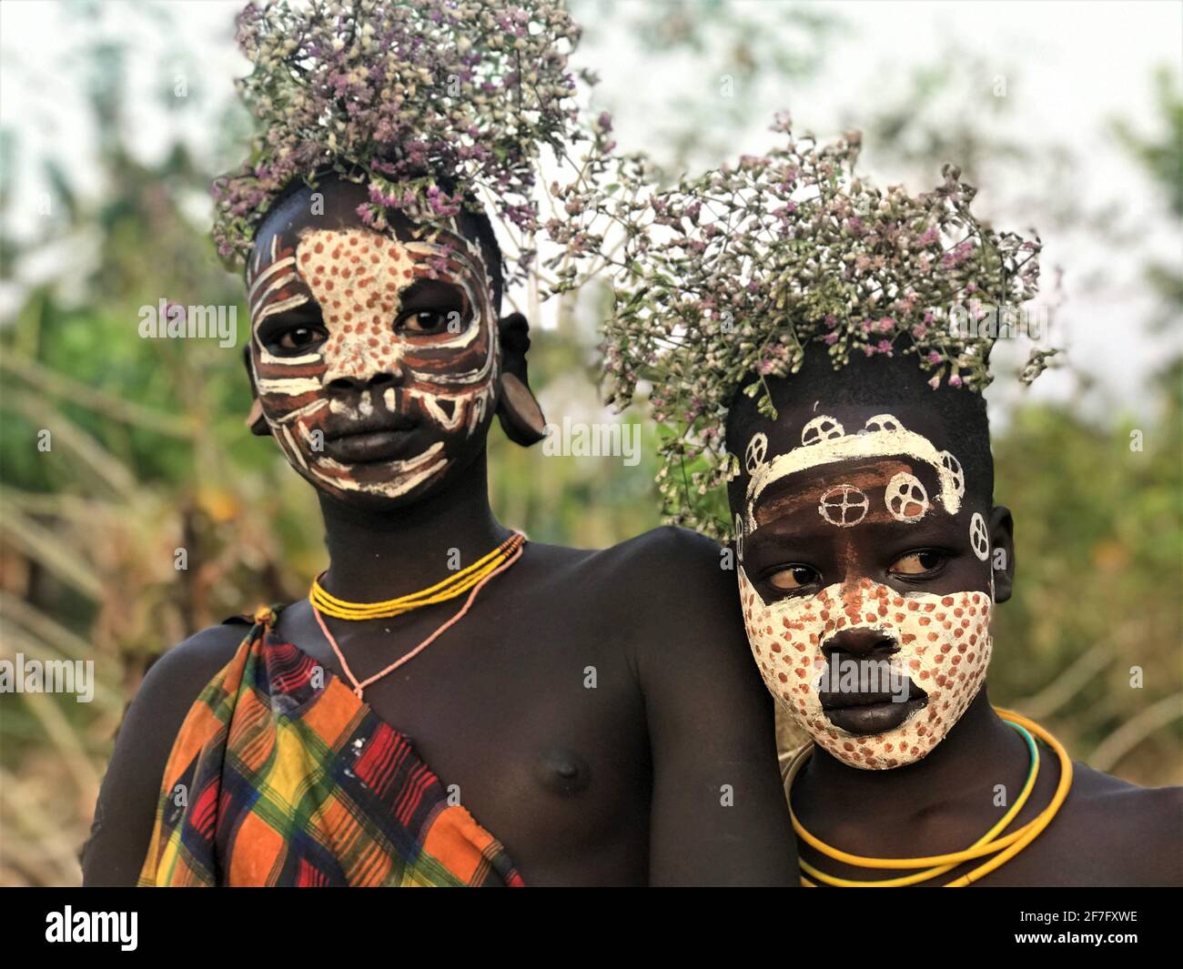 The tribe's decorative look attracts tourists. OMO VALLEY, ETHIOPIA ...