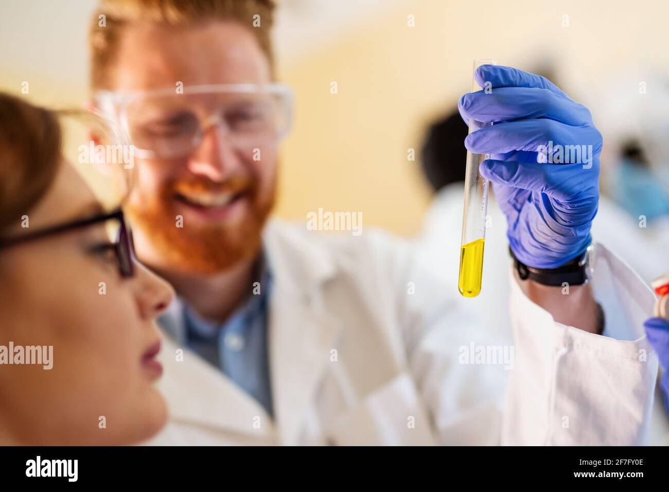 Group of medical scientists working at the laboratory. Research virus ...