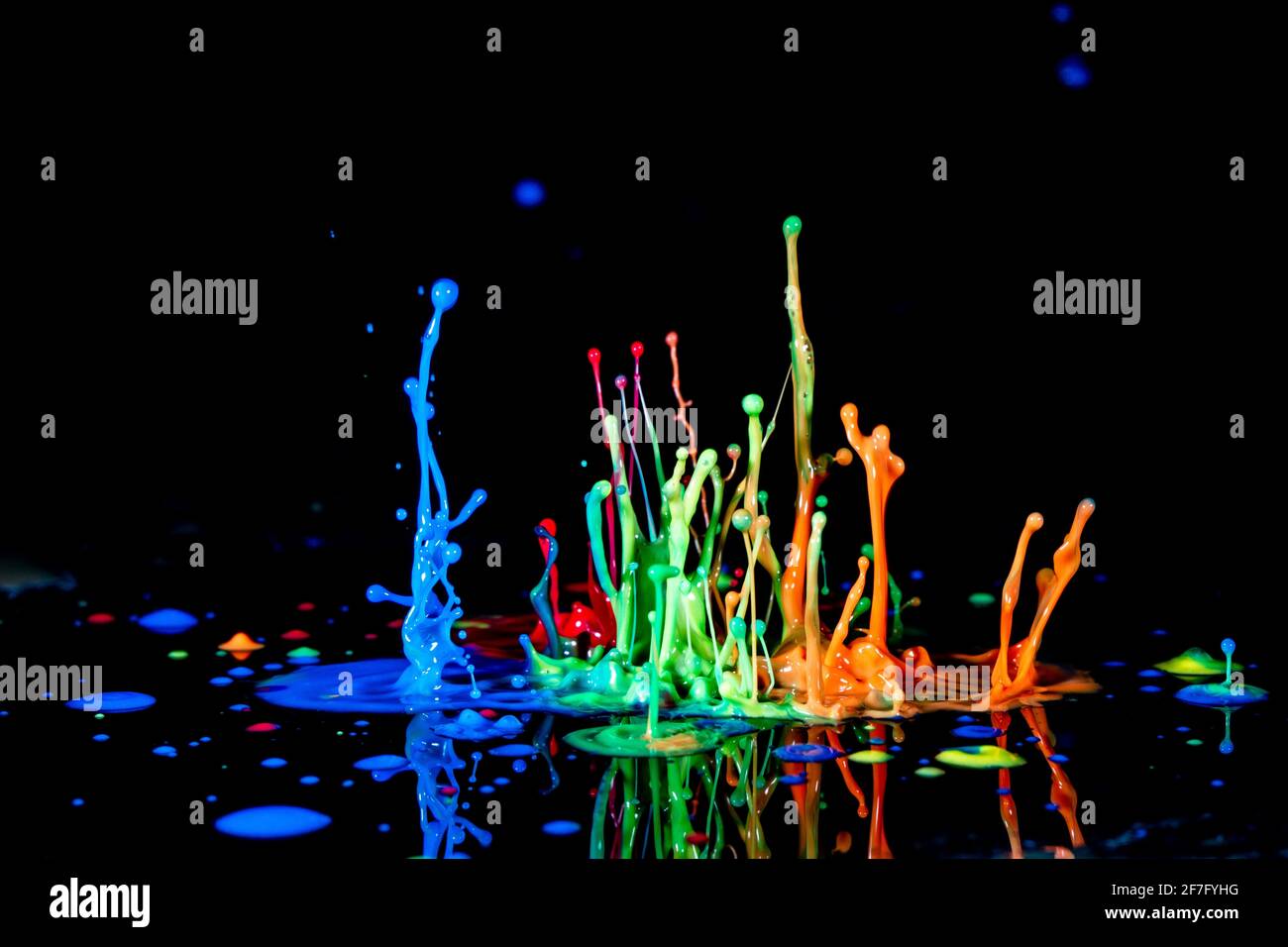 Abstract splash of color ink on black background Stock Photo - Alamy
