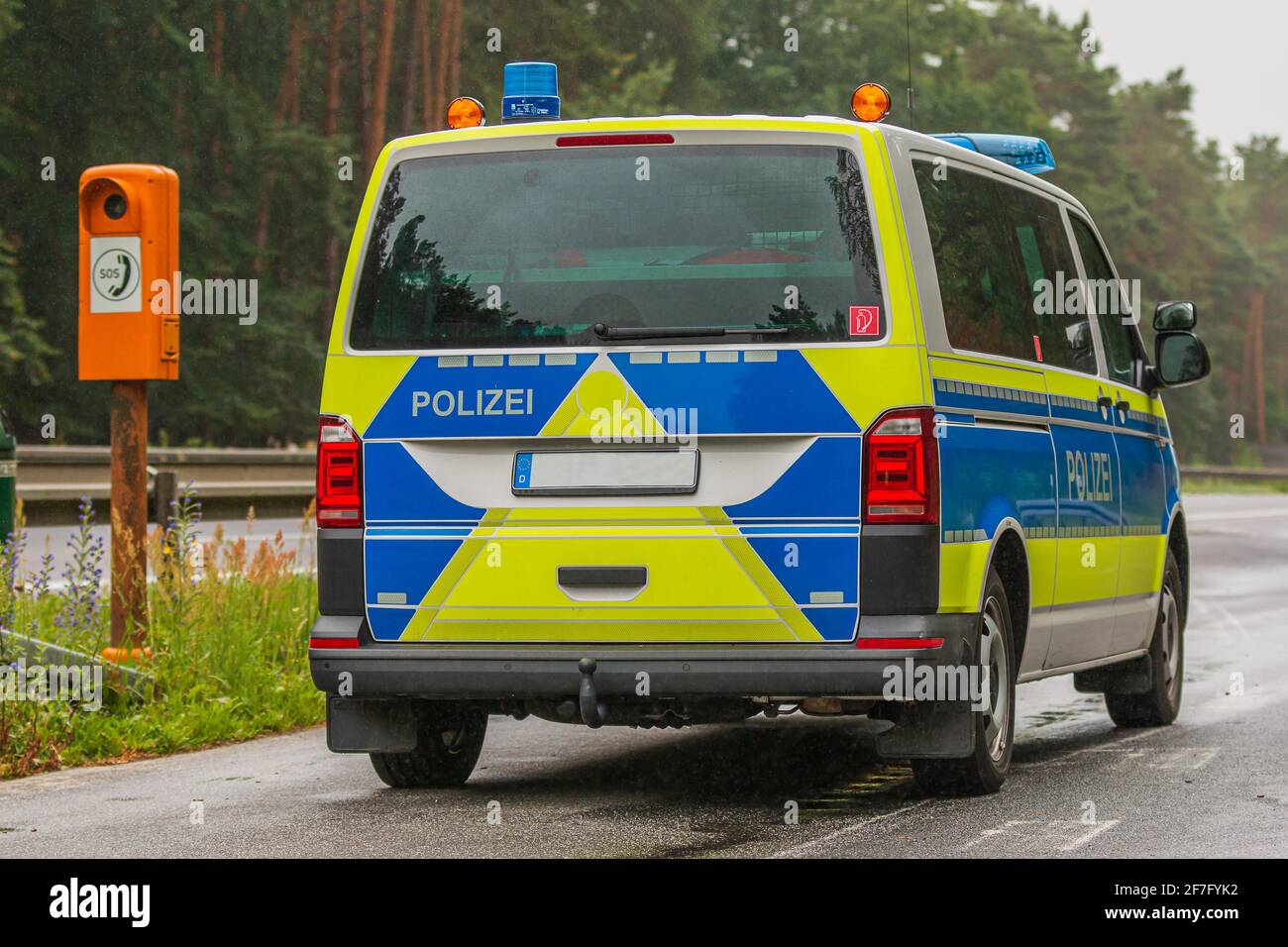 German police car on a motorway in the state of Brandenburg from a side ...