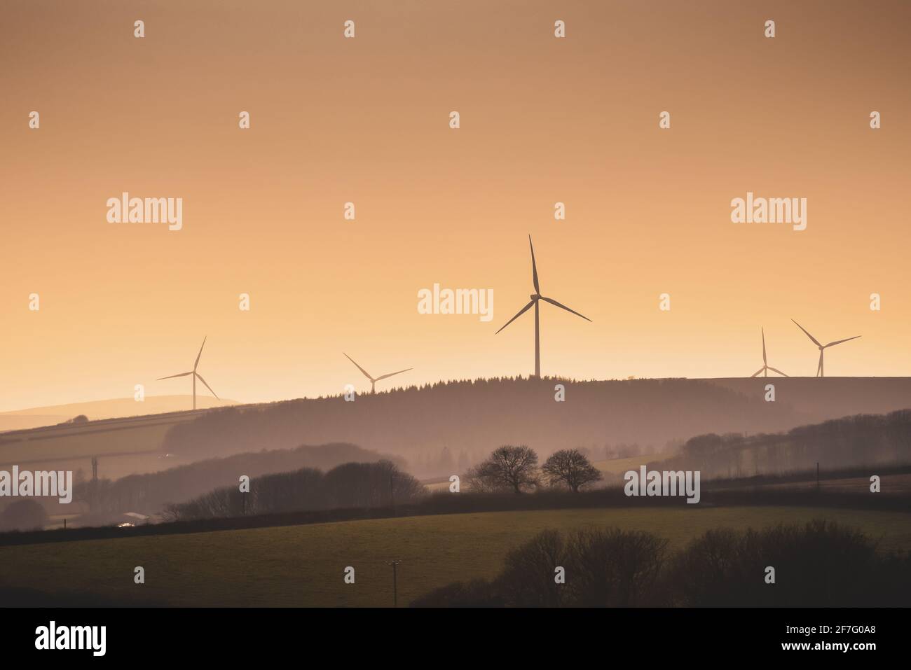 Wind turbines in a uk landscape for eco friendly power and renewable ...