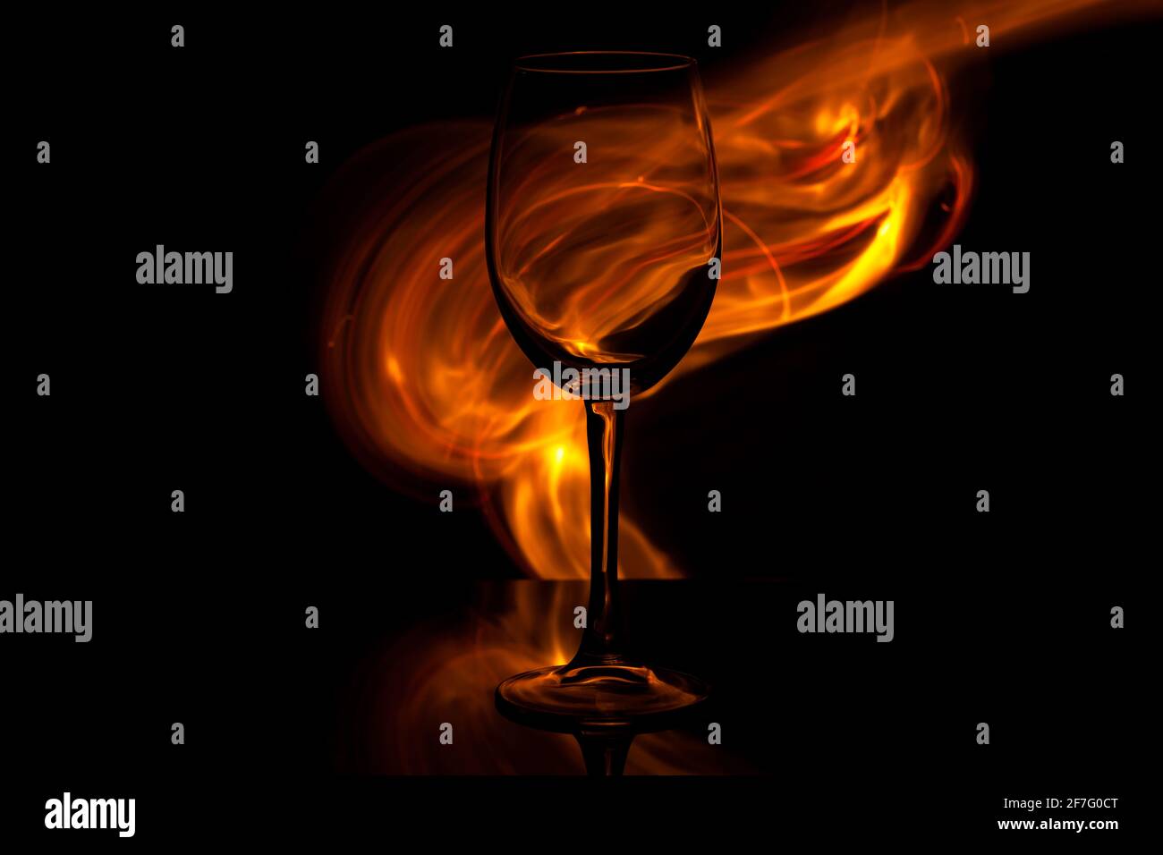 wine glass on fire, copy space, use as background Stock Photo - Alamy