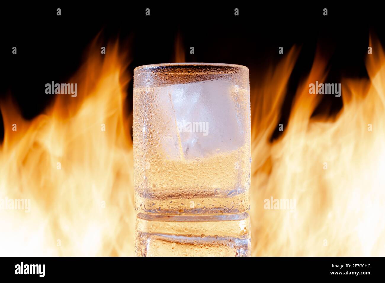 glass of vodka on a black background on fire Stock Photo - Alamy