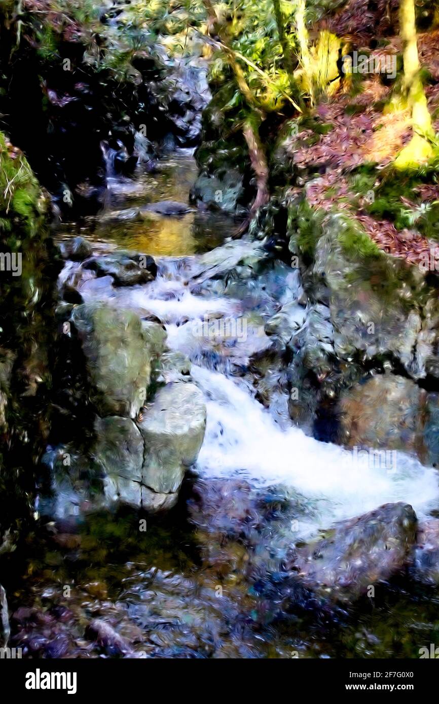 Mountain stream with a small cascade cutting its way through rocks ...