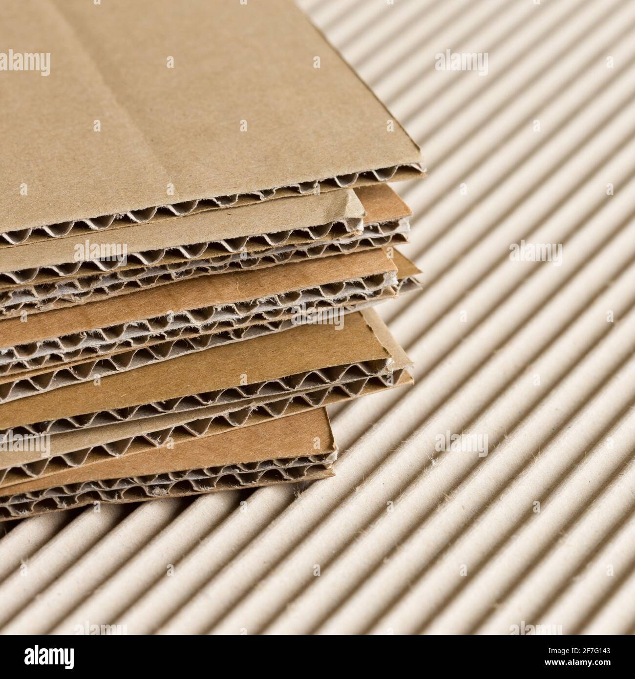 Pile of cardboard pieces on corrugated cardboard Stock Photo - Alamy
