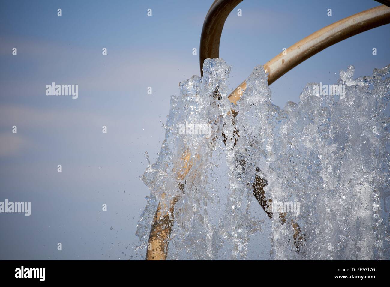 Water splashing in the fountain. Freeze motion effect achieved by fast ...