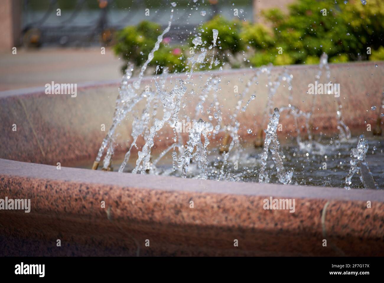 Water splashing in the fountain. Freeze motion effect achieved by fast ...