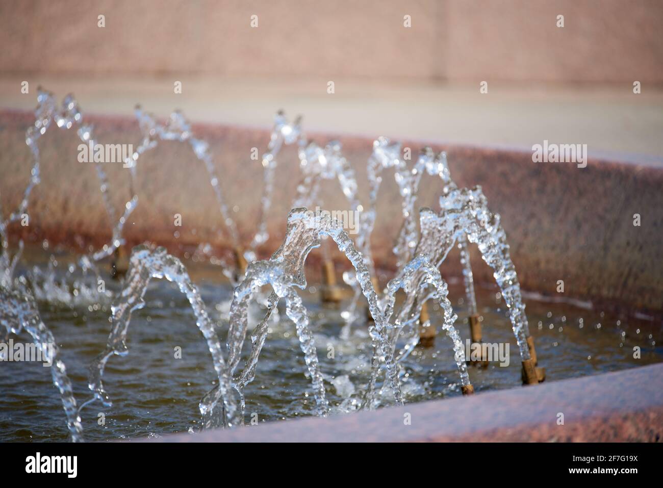 Water splashing in the fountain. Freeze motion effect achieved by fast ...
