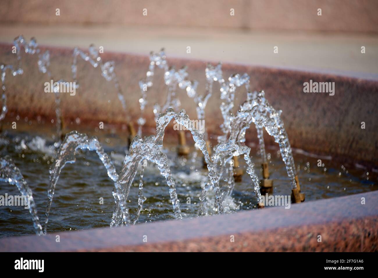 Water splashing in the fountain. Freeze motion effect achieved by fast ...