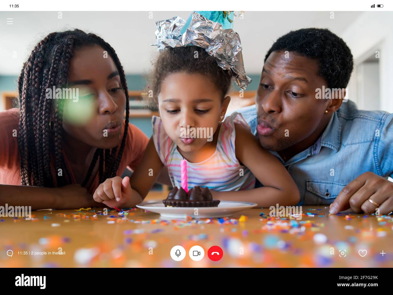 Family celebrating birthday on a video call Stock Photo - Alamy