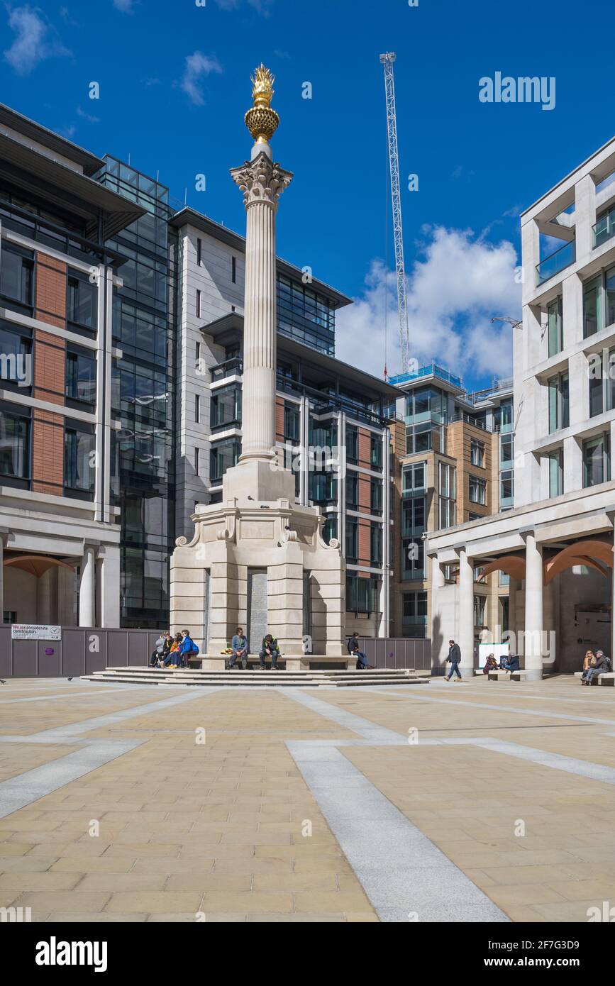 People relaxing in Paternoster Square. The column commemorates fires ...