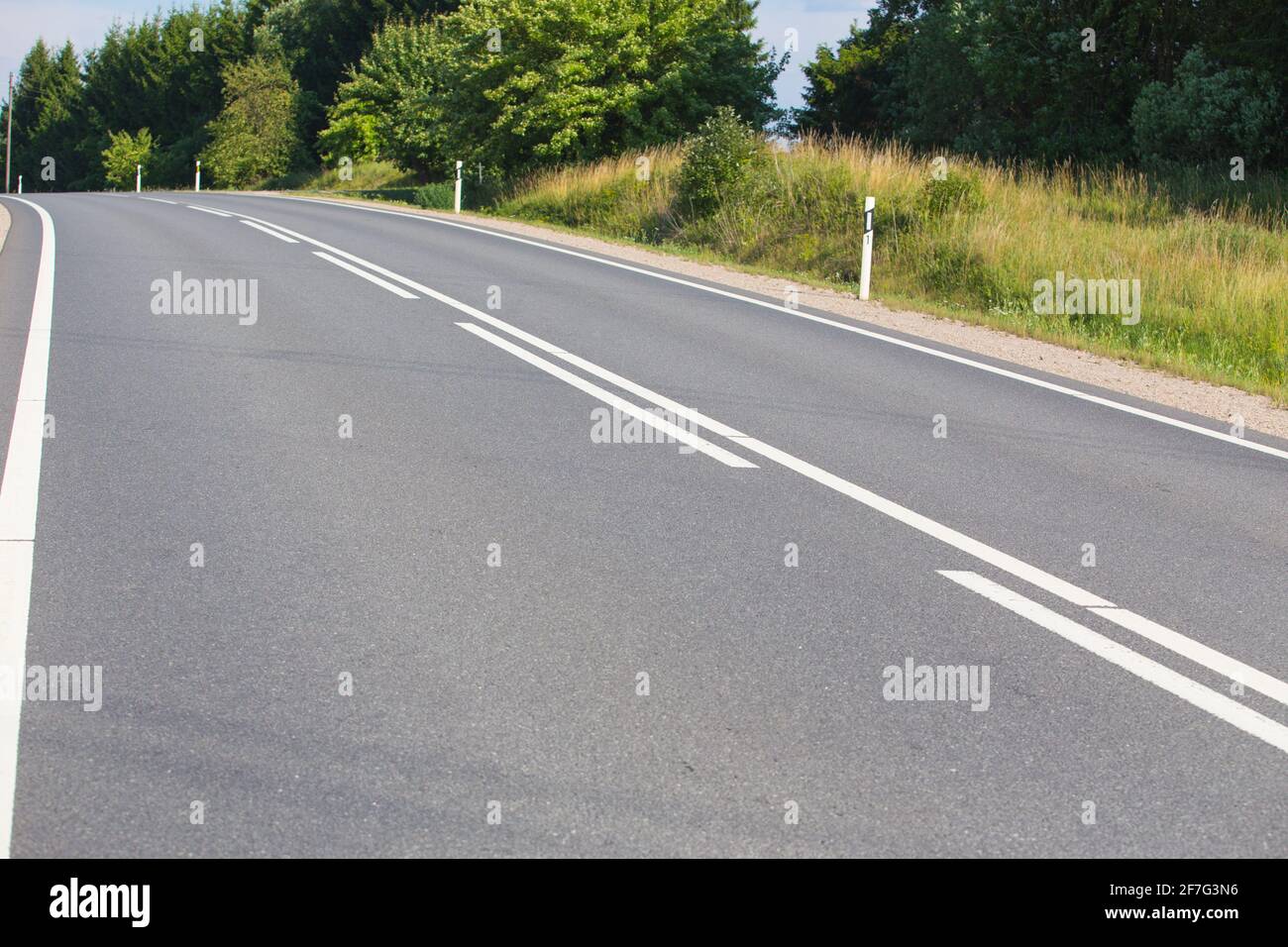 Asphalt country highway, trees, grass, field in summer Stock Photo - Alamy