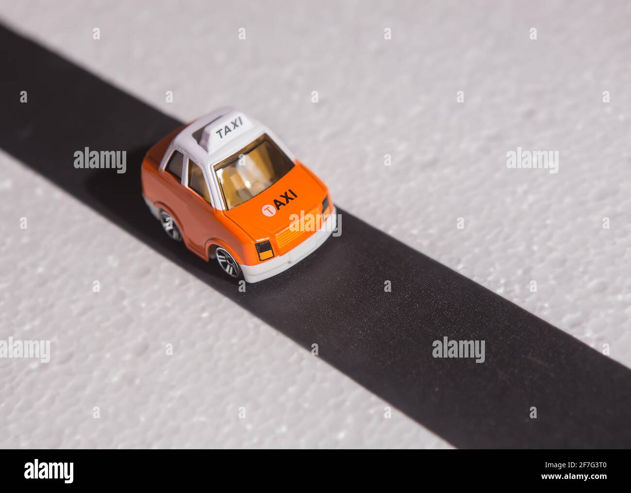 Toy car moves along the road. Concept of transport services Stock Photo ...