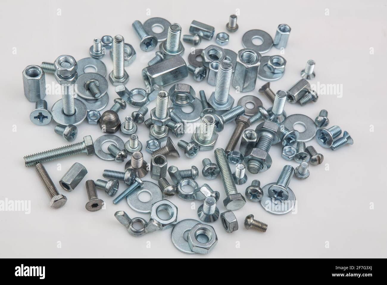 chromeplated bolts and nuts on white background Stock Photo - Alamy