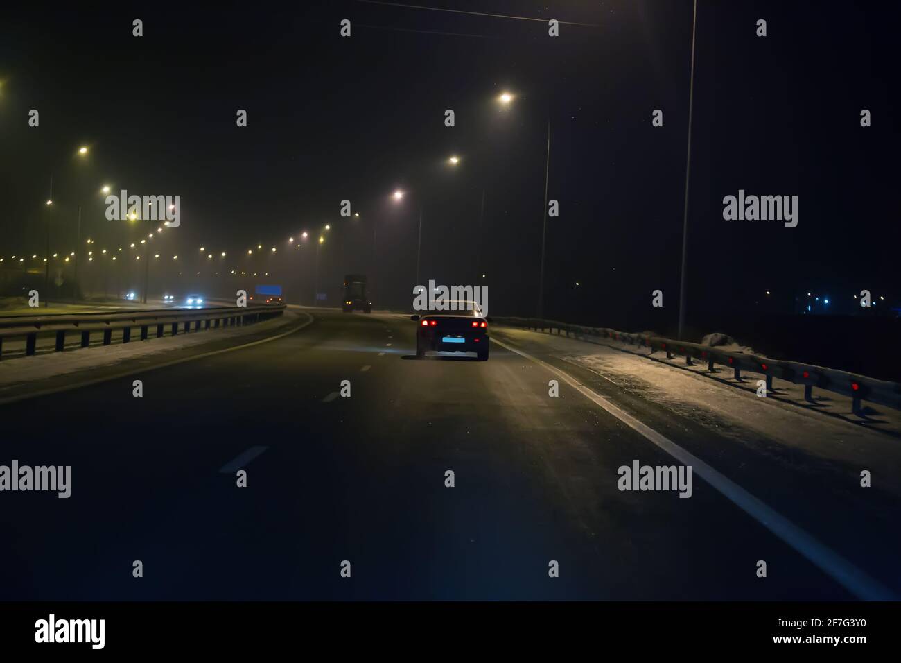 Night driving on snowy highway hi-res stock photography and images - Alamy