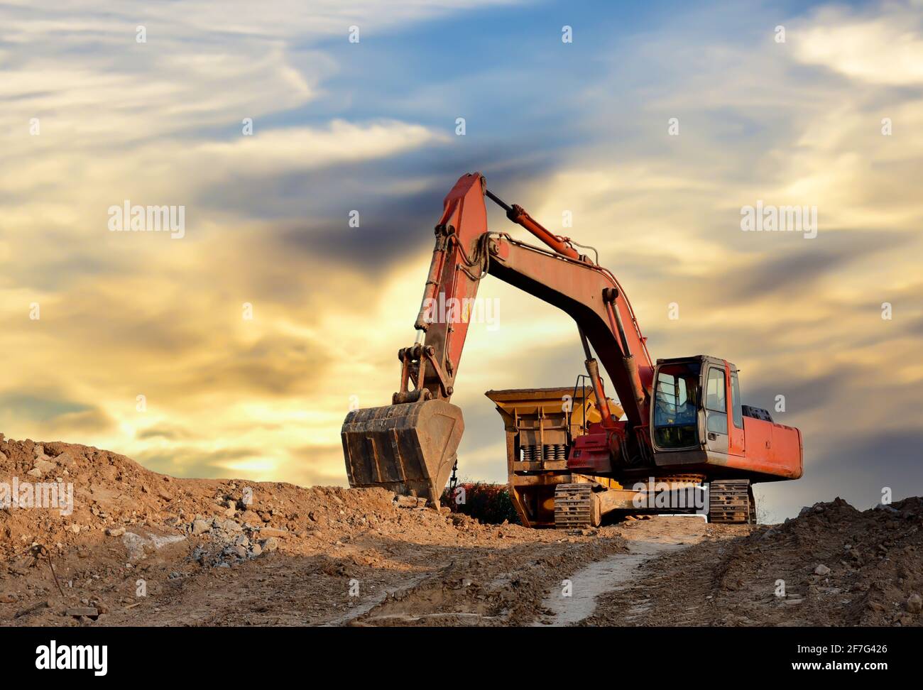 Mobile Stone Jaw crusher machine and excavator during crushing concrete ...