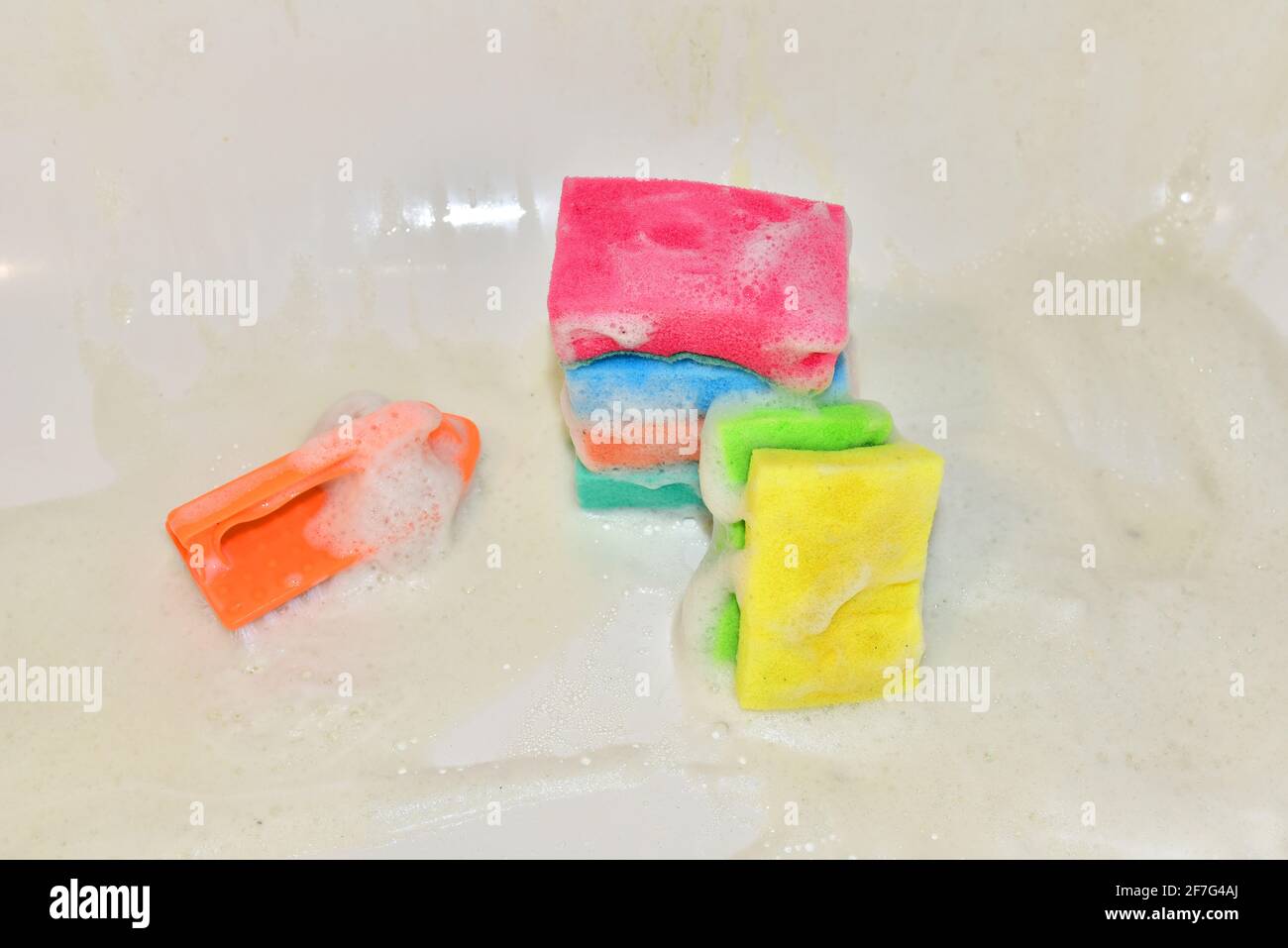 Sponge with detergent and foam while washing. Cleaning Kitchen ...