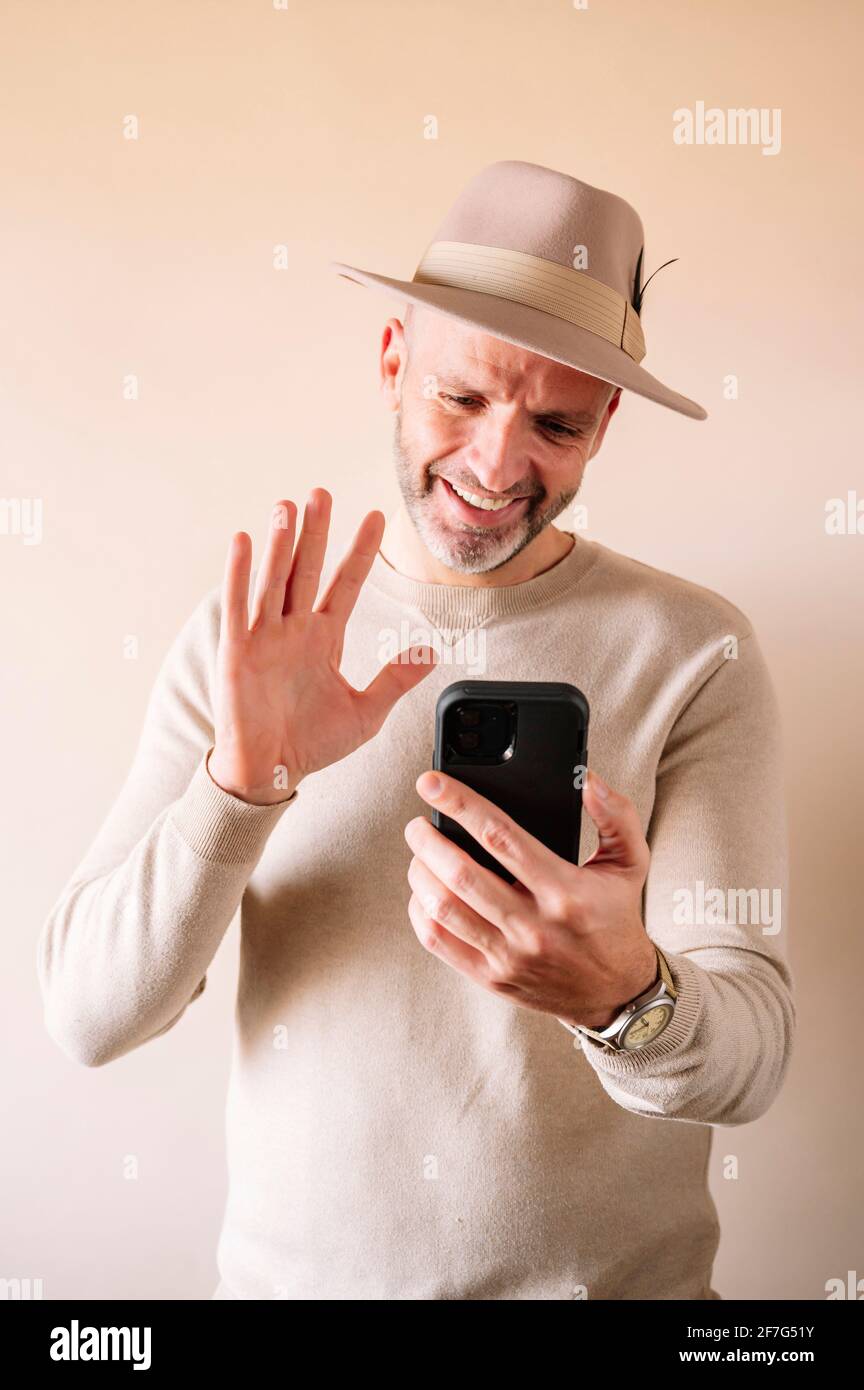 Man making a video call with smart phone Stock Photo - Alamy