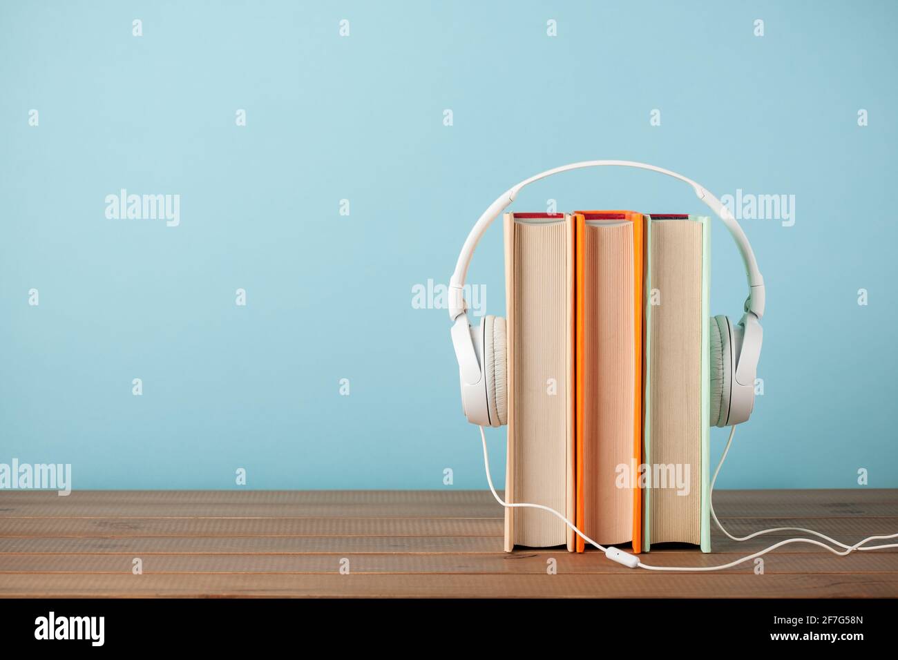 Stack of books with headphones Stock Photo - Alamy