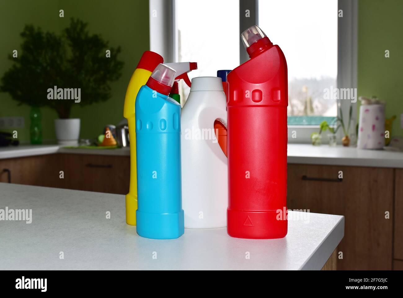 Detergent bottles at kitchen in home. Detergents and laundry concept ...
