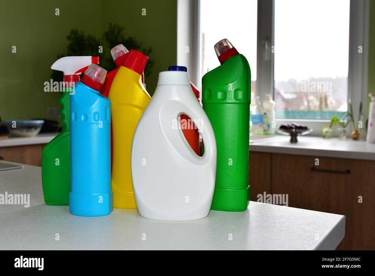 Detergent bottles at kitchen in home. Detergents and laundry concept ...