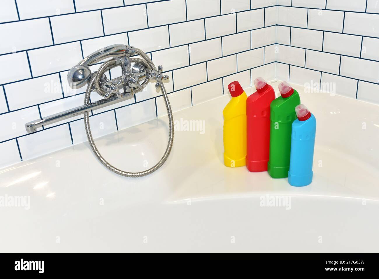 Detergent for clean in bathroom on background of white tiles ...