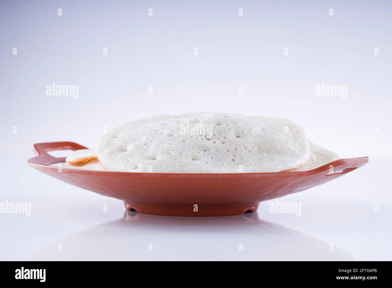 South Indian traditional breakfast Dosa or Thattu dosa made using cast ...