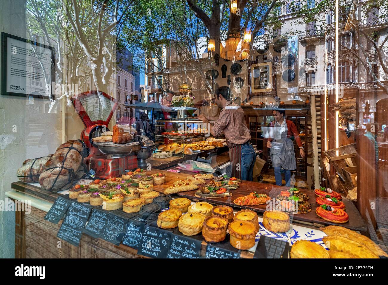 Street reflection in a glass showcase and freshly baked traditional ...