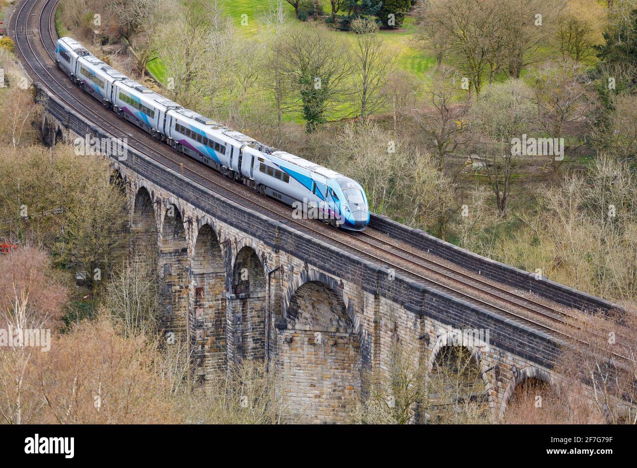 A TransPennine Express train crosses the viaduct at Brownhill ...