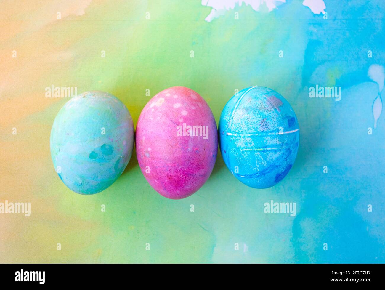 Watercolor background with colorful rainbow Easter eggs Stock Photo - Alamy