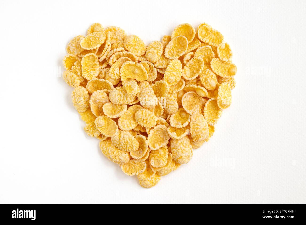 Heart made of corn flakes isolated on white background. Top view Stock ...