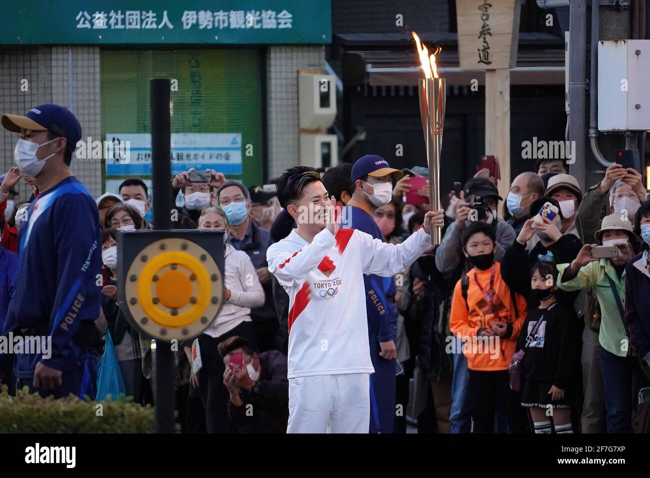 A torch bearer of Tokyo Olympics Games Torch Relay seen waving at the ...