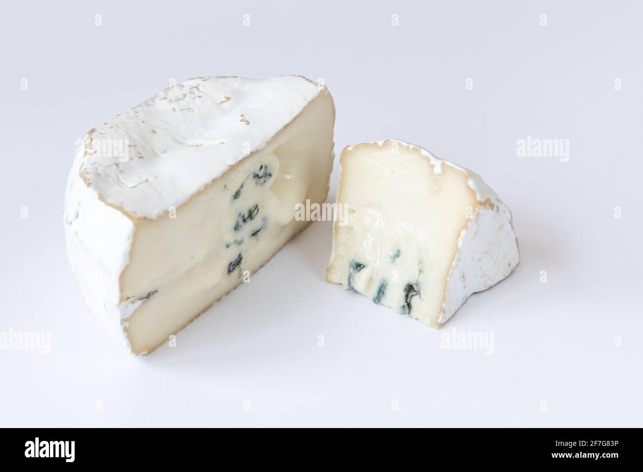Pieces of camembert or brie cheese isolated on white background. Soft ...