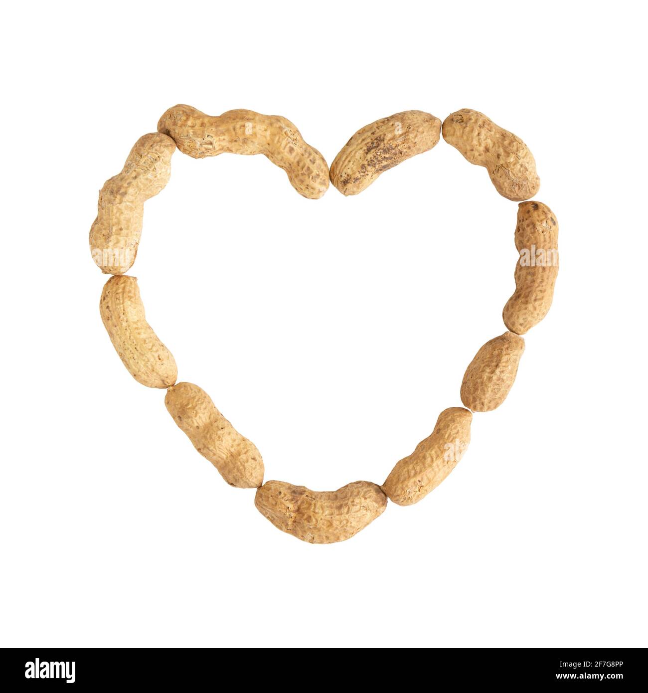 Peanut made in heart shape on white background. Top view. Flat lay ...
