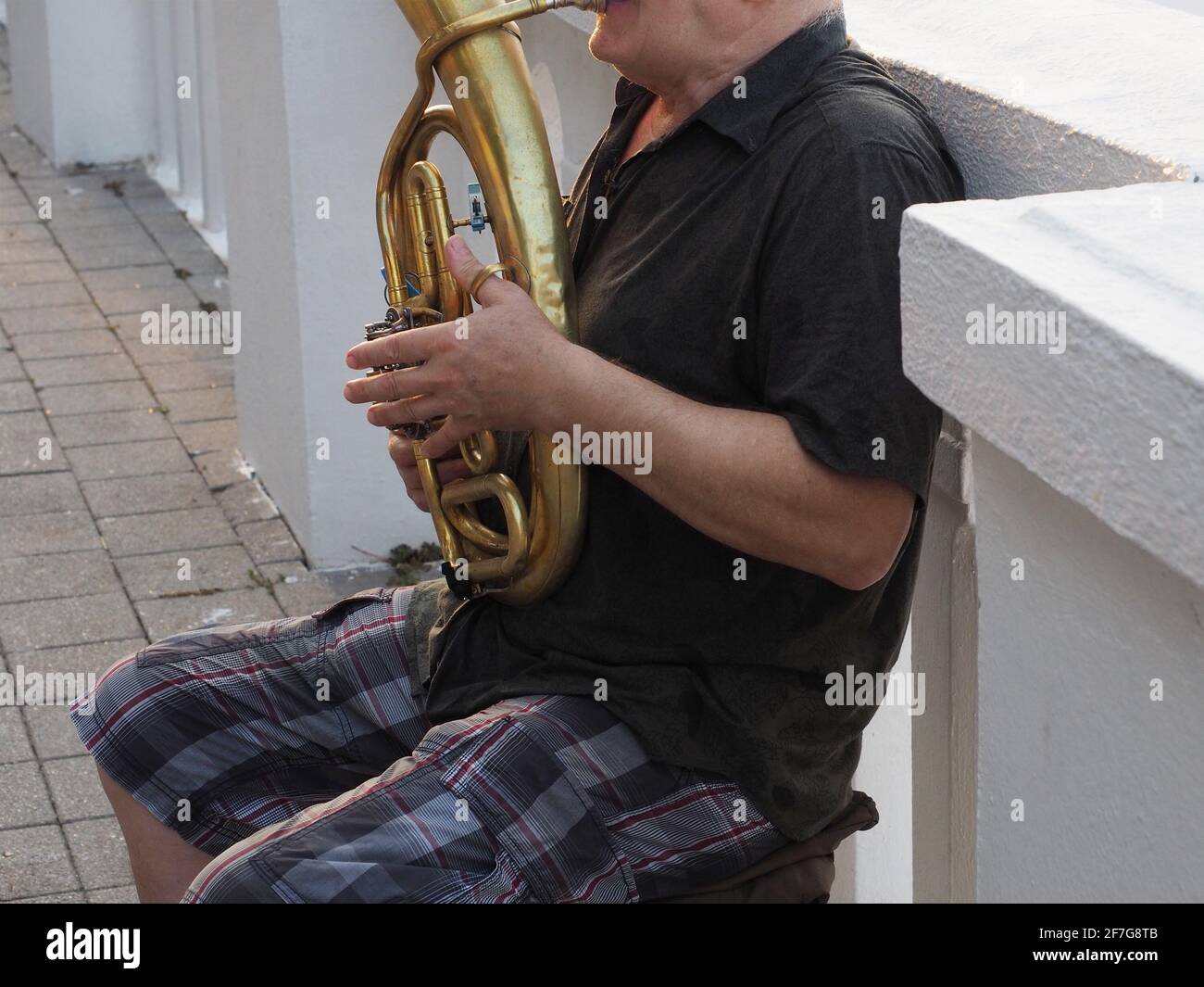 Russia, Sochi 20.07.2020. Elderly street saxophonist playing outdoors ...