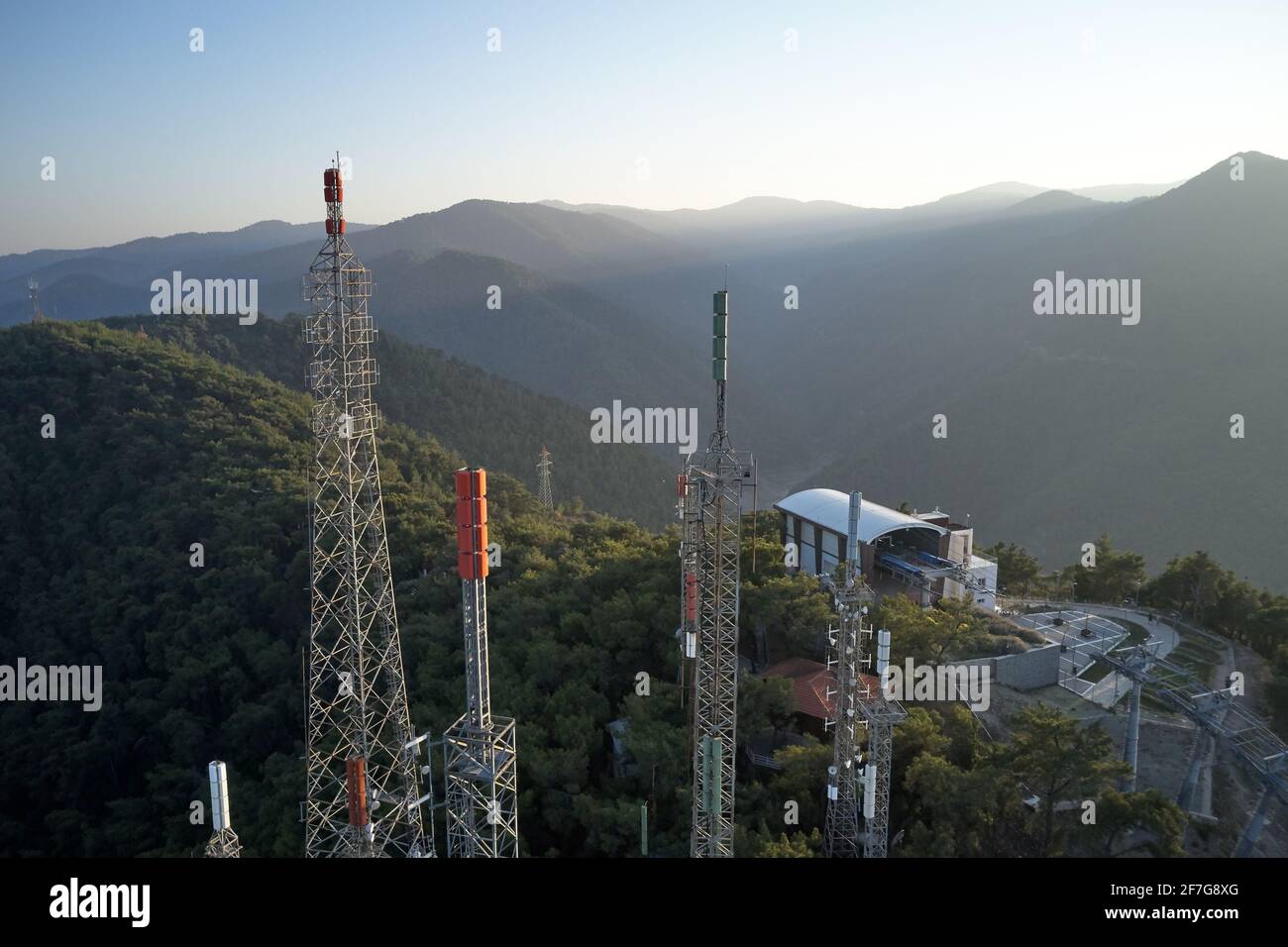 Electrical towers on the background of mountains Stock Photo - Alamy