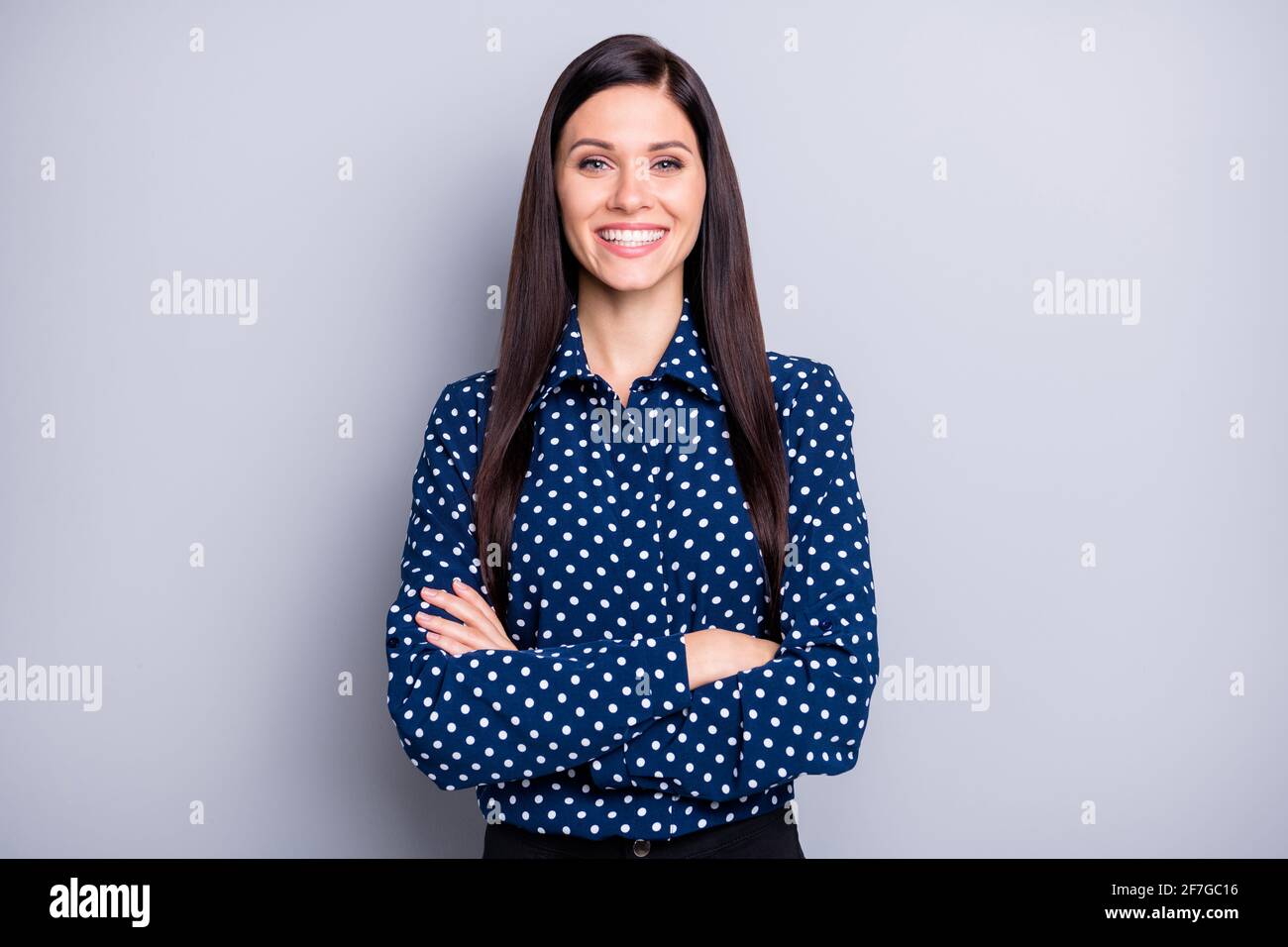 Photo of optimistic brunette girl crossed arms wear blue blouse ...