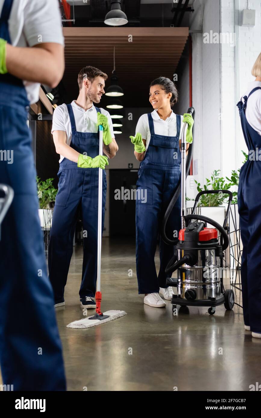Smiling multiethnic cleaners supplies hi-res stock photography and ...