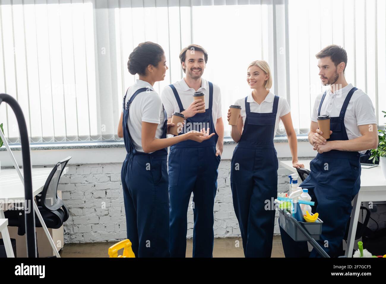 Smiling multiethnic cleaners supplies hi-res stock photography and ...