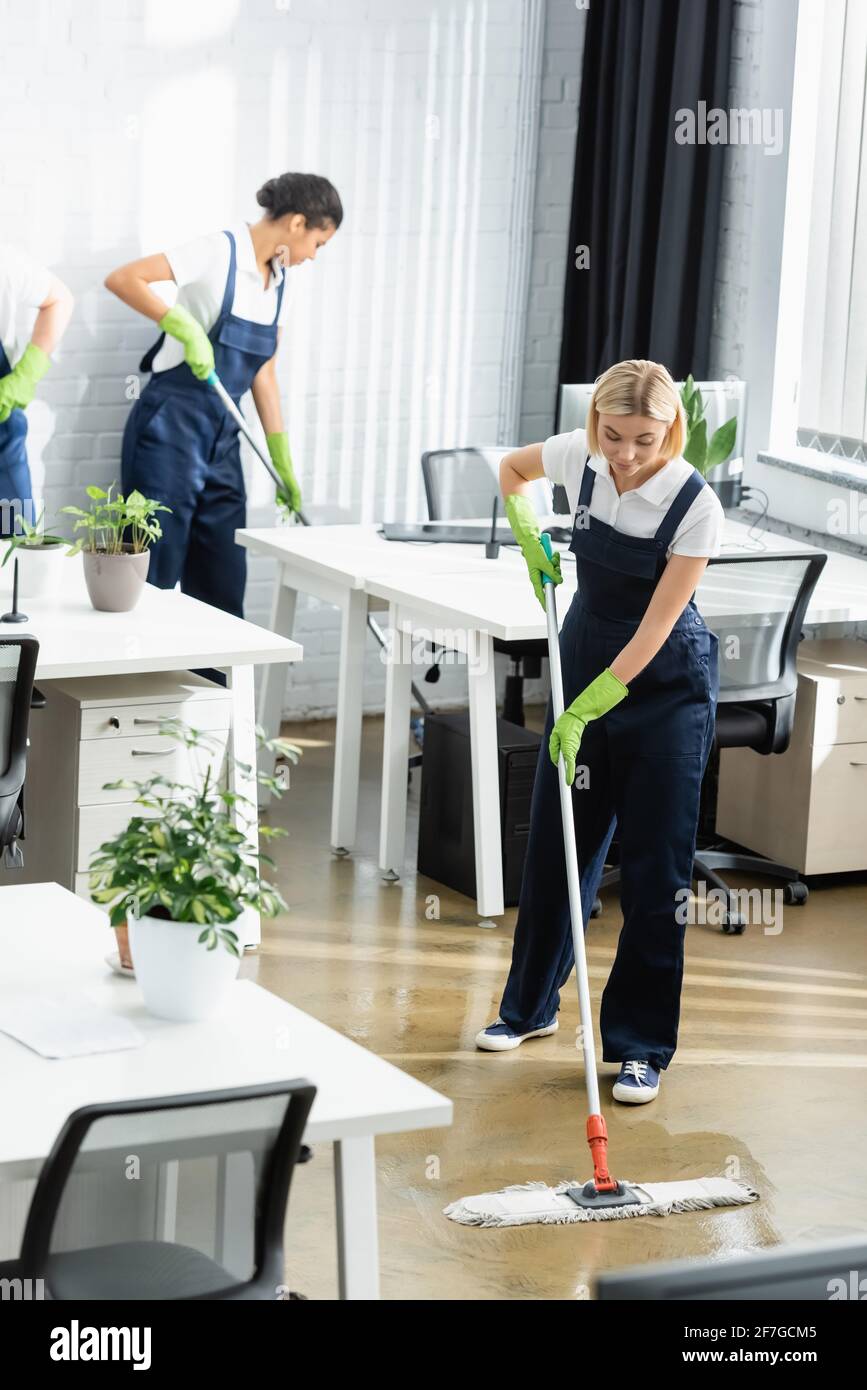 Black woman floor office cleaning hi-res stock photography and images ...