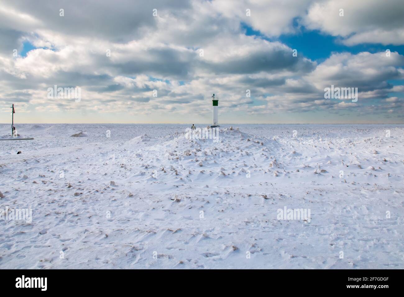 Grand Bend, Ontario, Canada - A man walks back from the edge of the ...