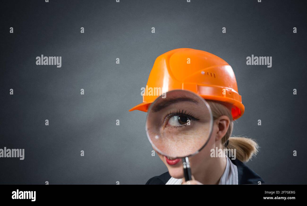 Technical inspector looking through magnifier Stock Photo - Alamy